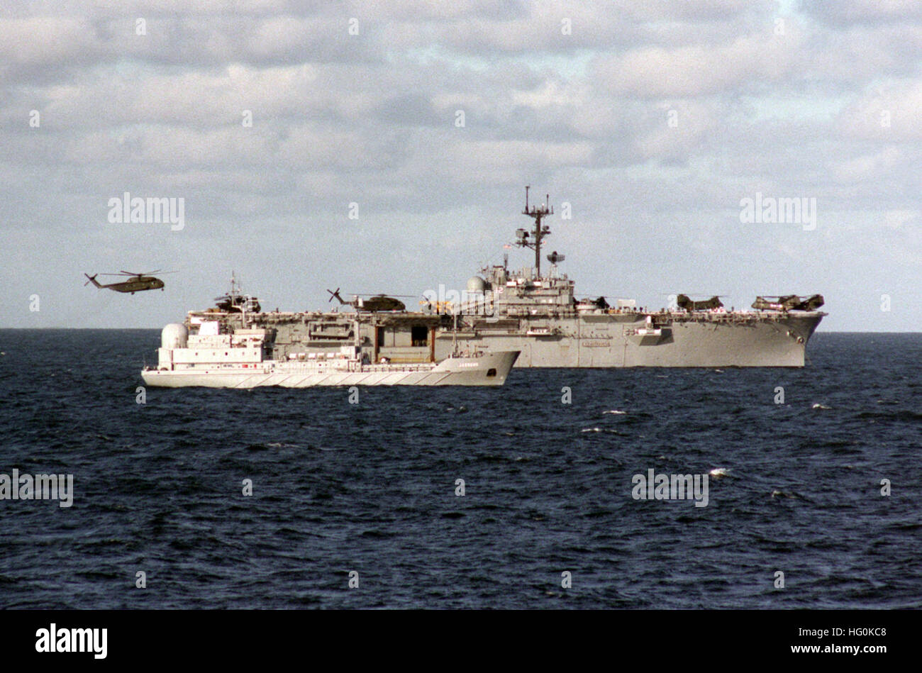 USS Inchon (LPH-12) with East German SIGINT ship Jasmund 1986 Stock ...