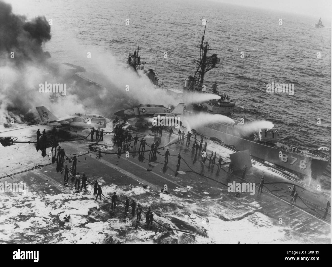USS Rogers (DD-876) alongside burning USS Enterprise (CVN-65 Stock ...
