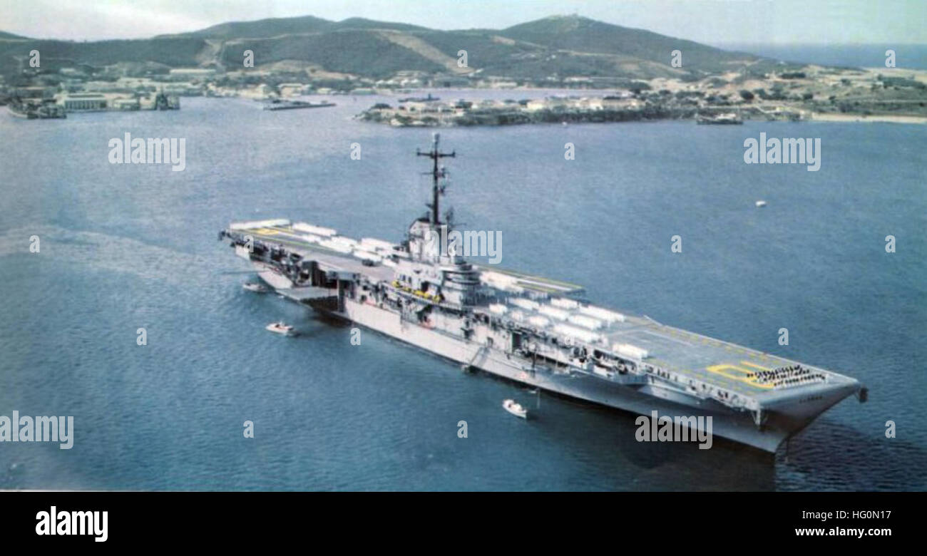 The aircraft carrier USS Wasp (CVS-18) lies at anchor in 1958, showing ...