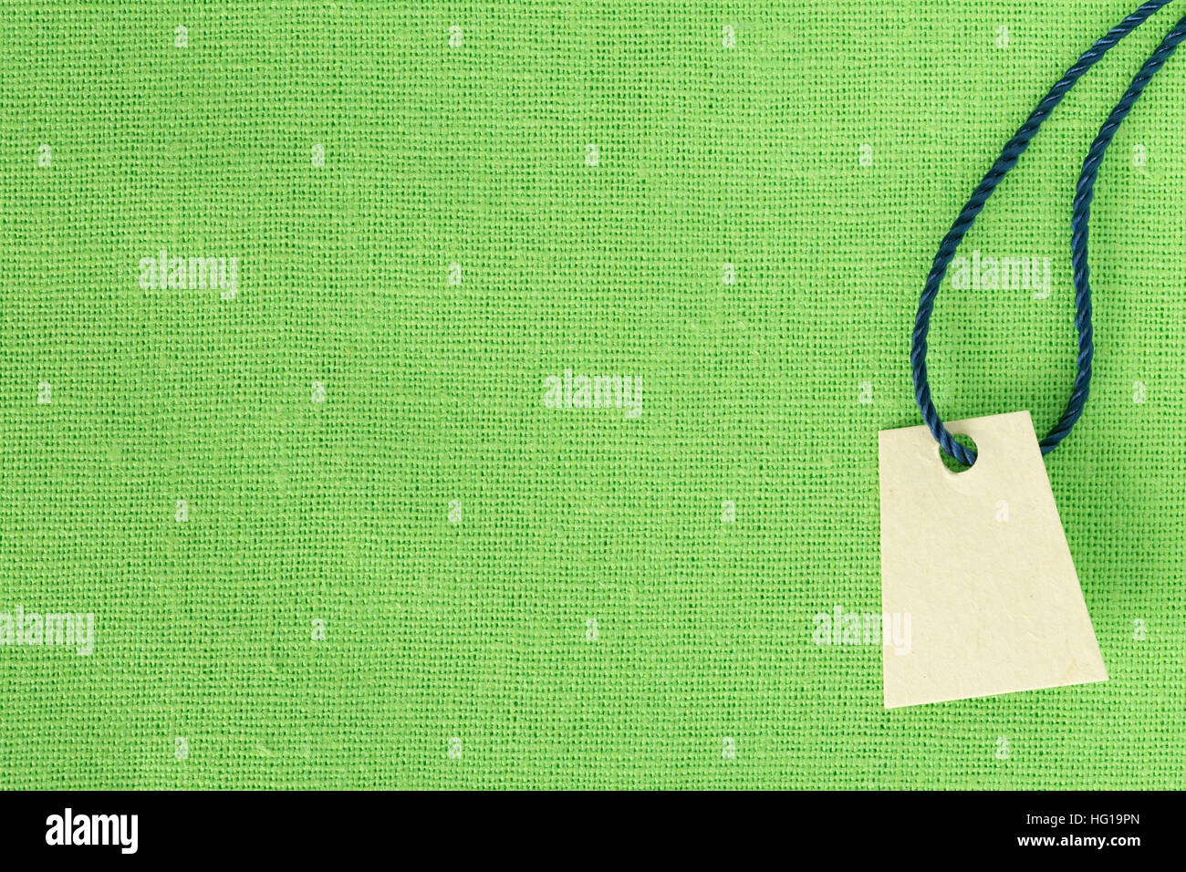 Light green Fabric Background and blank Price Tag Stock Photo - Alamy