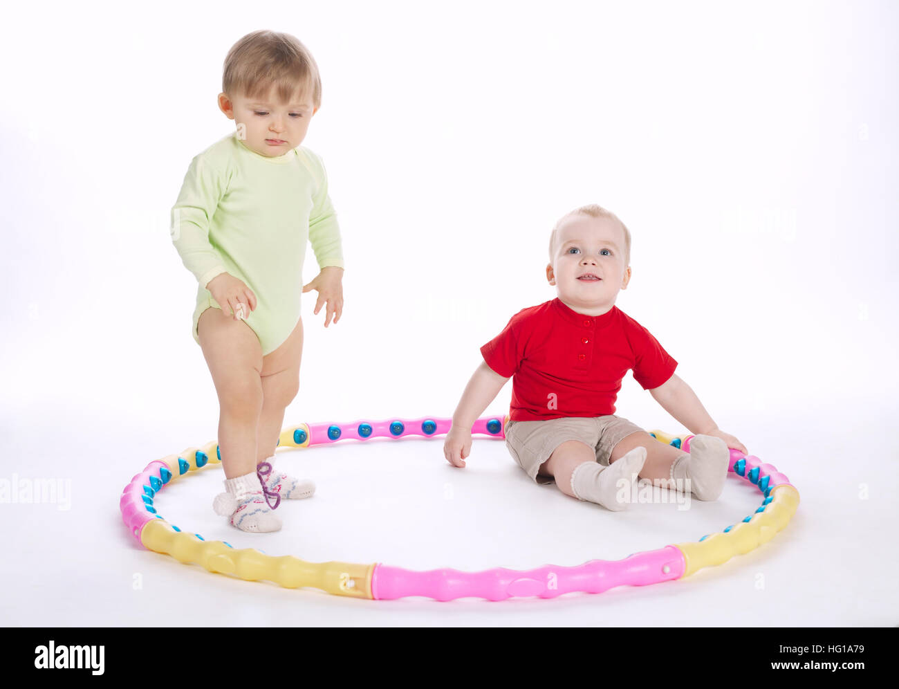 beautiful funny children playing with hoop Stock Photo - Alamy