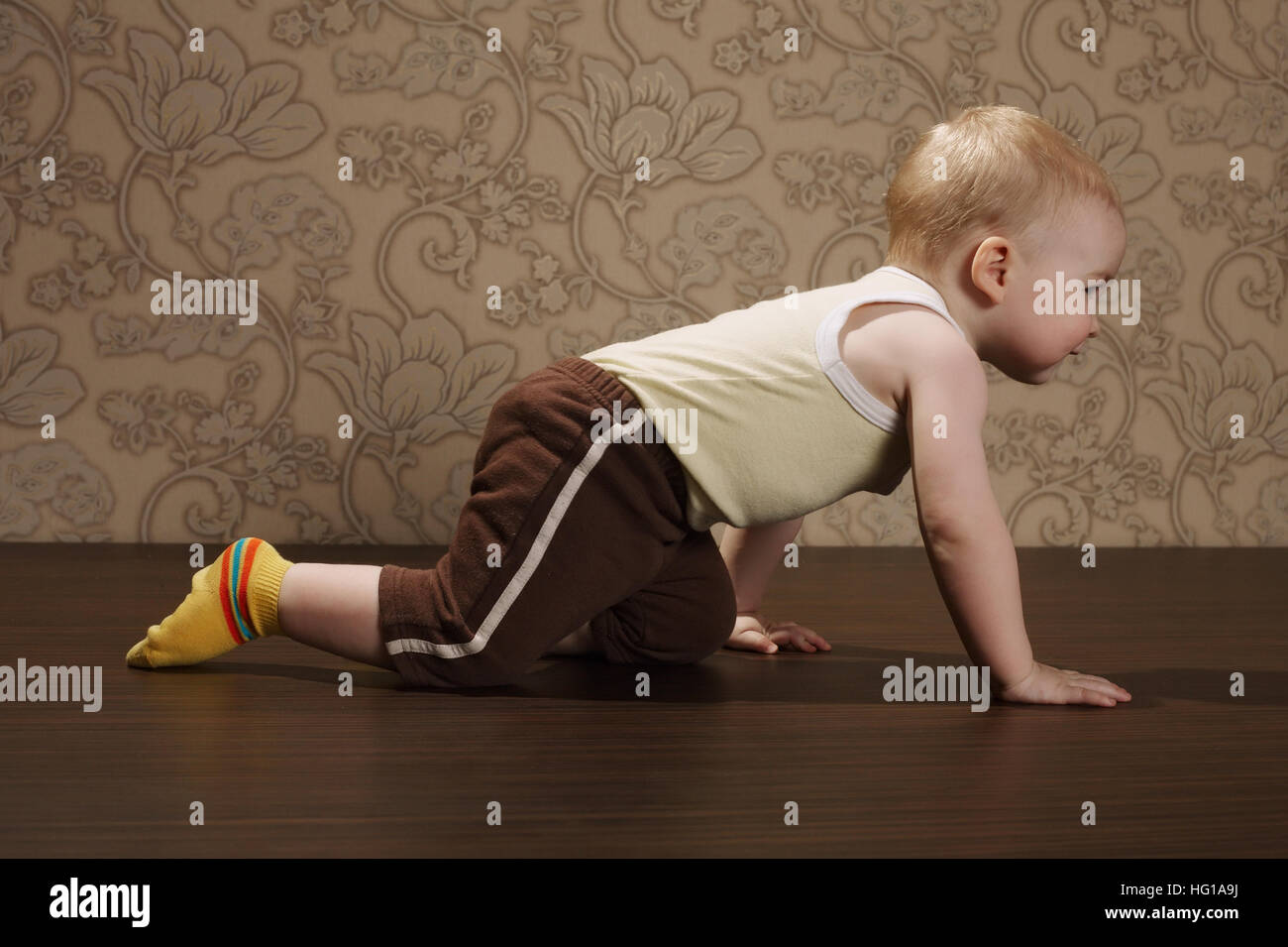 little boy crawling on the floor Stock Photo - Alamy