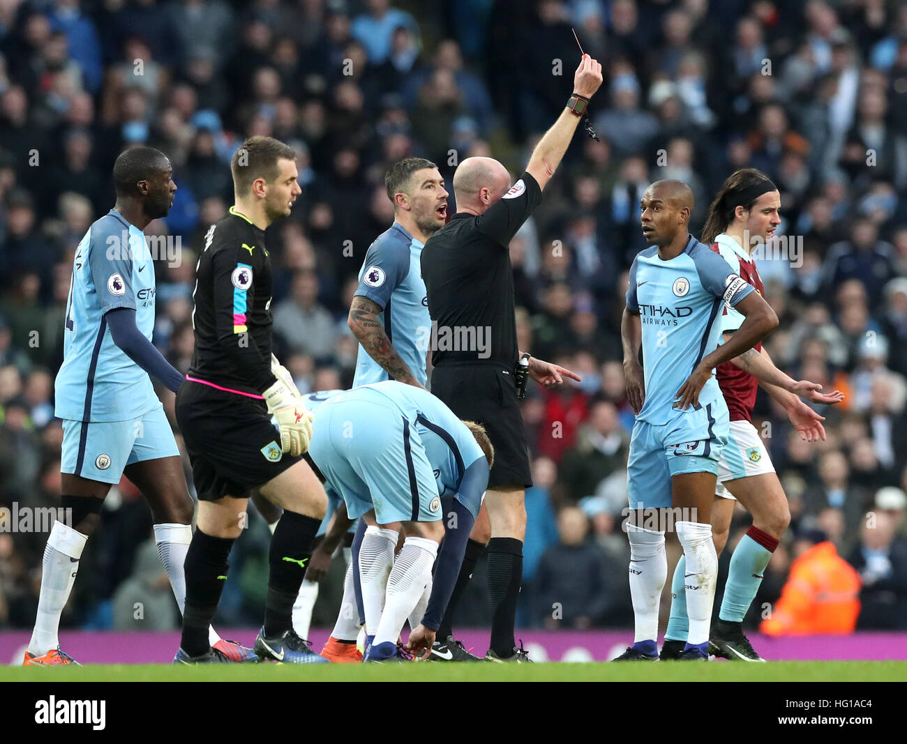 Manchester City's Fernandinho is shown the red card by referee Lee ...