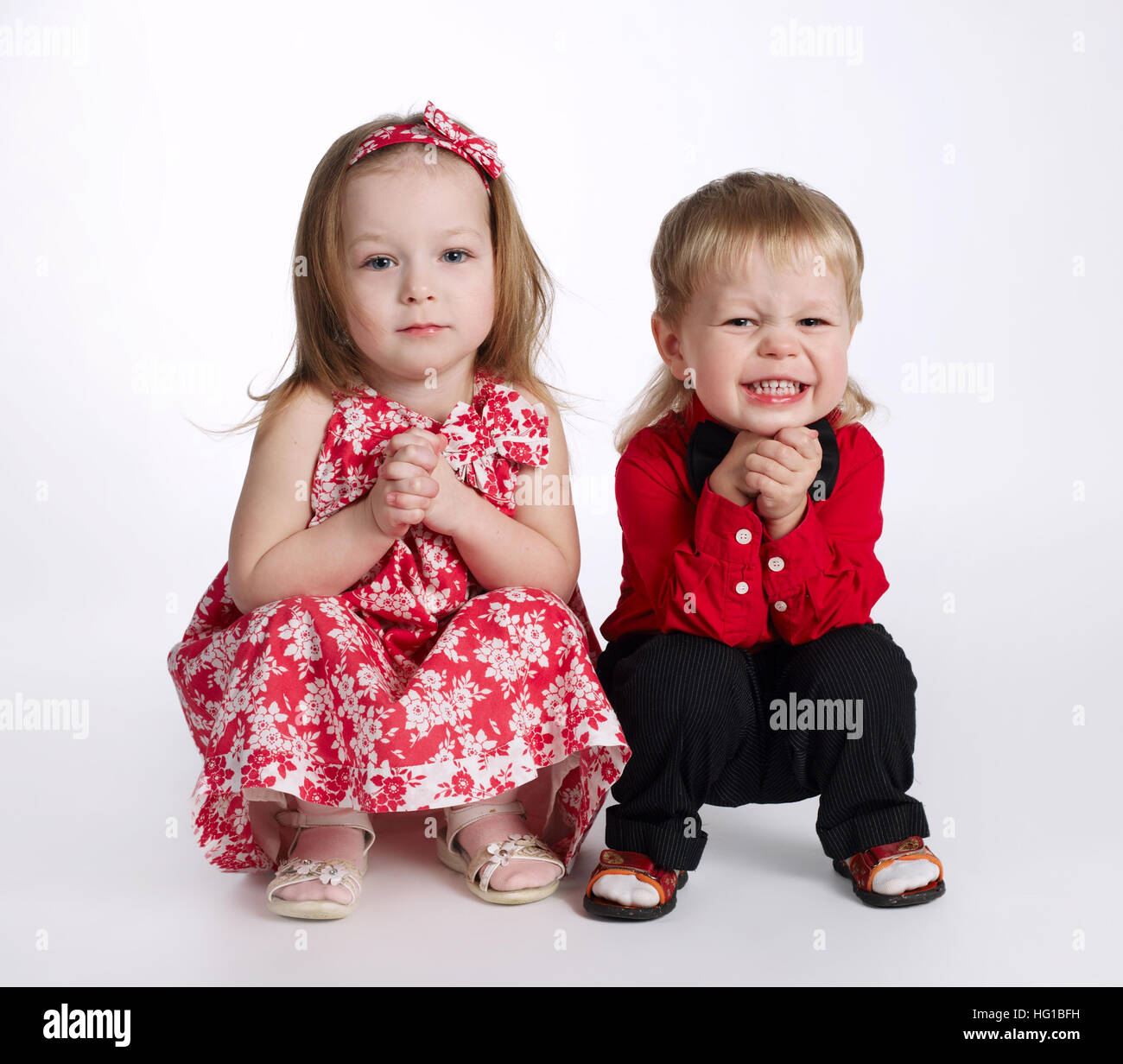 lovely boy and girl on white Stock Photo - Alamy