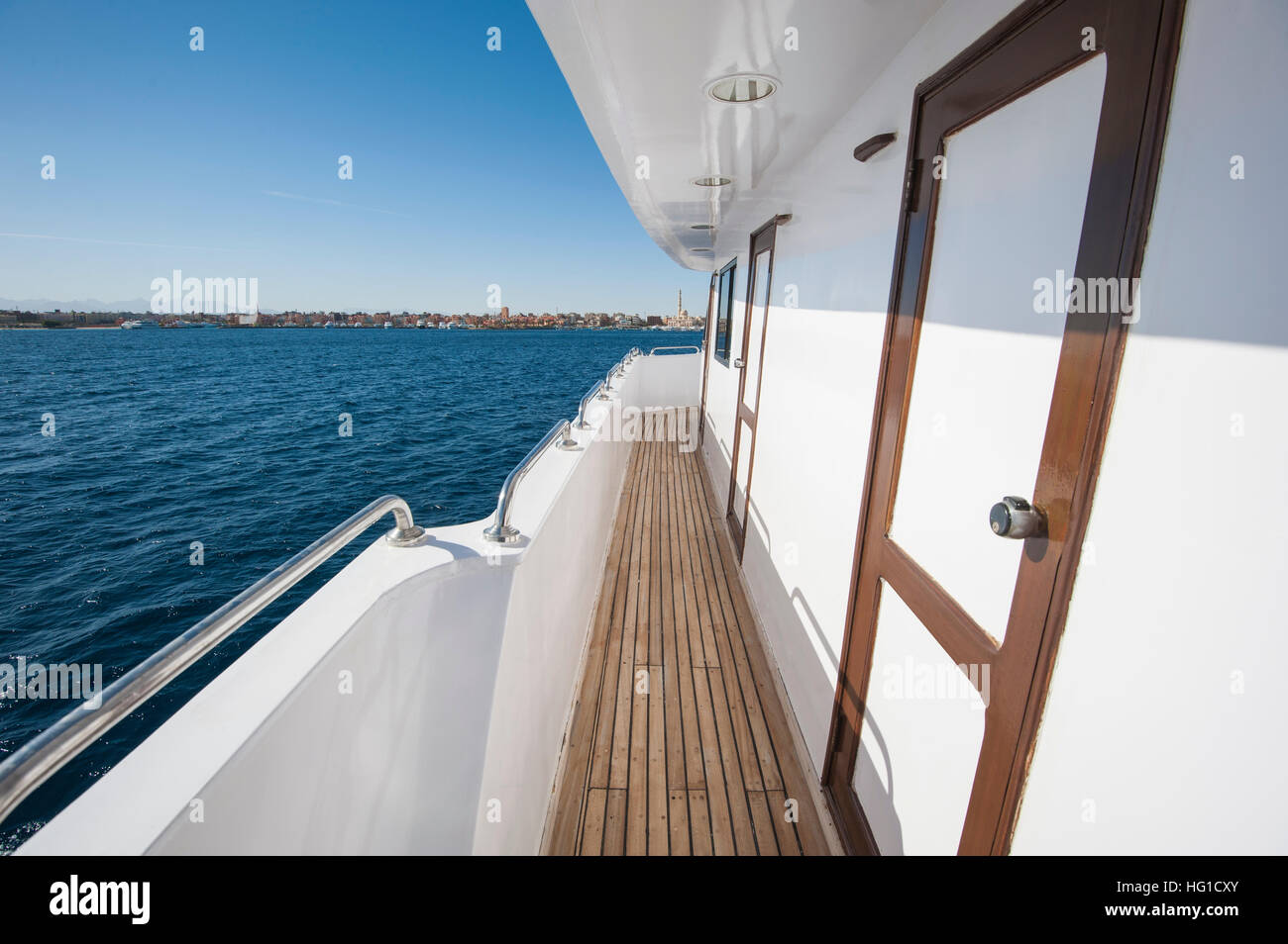 View along gangway down side of a large private motor yacht under way ... View along gangway down side of a large private motor yacht under way ...