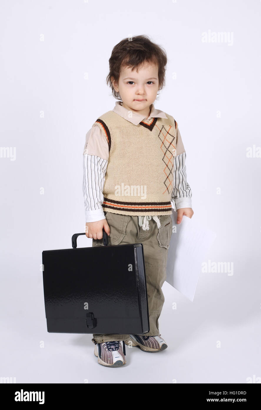 funny boy with case on white Stock Photo - Alamy
