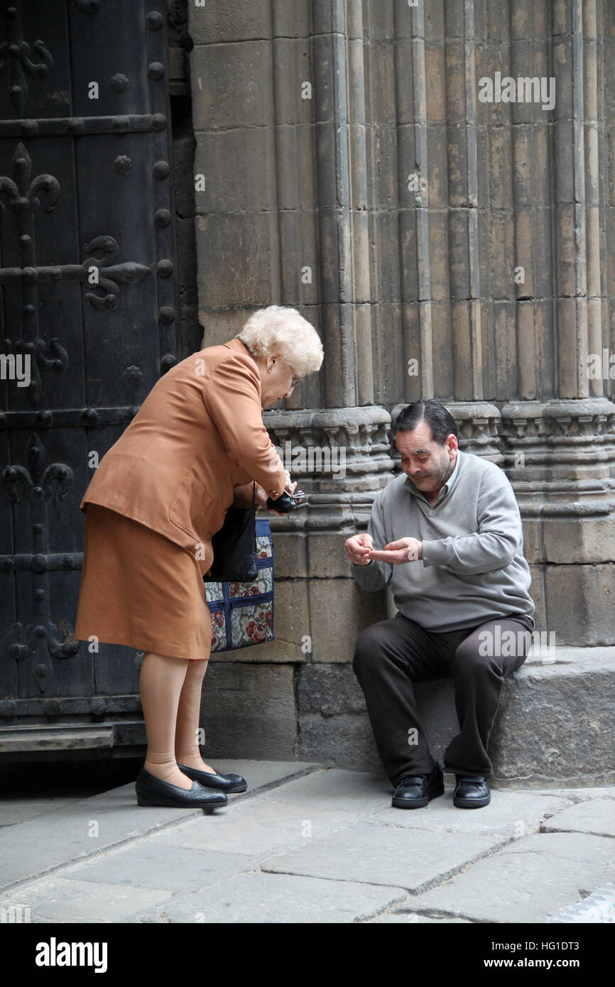 Beggar Money Giving High Resolution Stock Photography and Images - Alamy