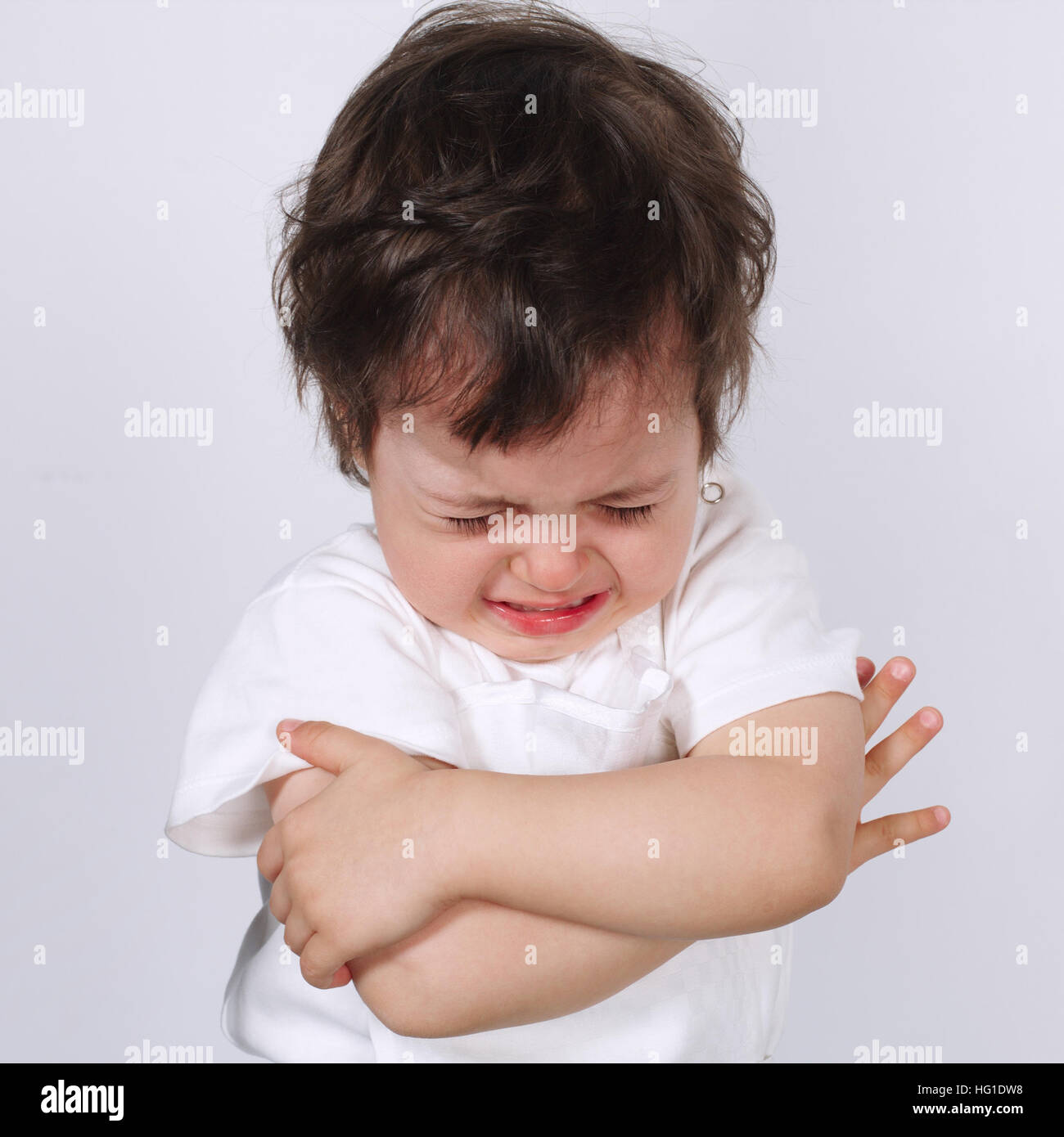 cute crying boy on white background Stock Photo - Alamy