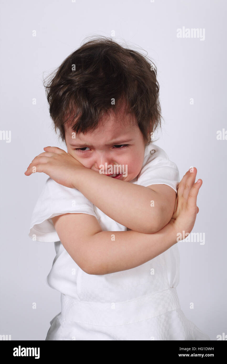cute crying boy on white background Stock Photo - Alamy