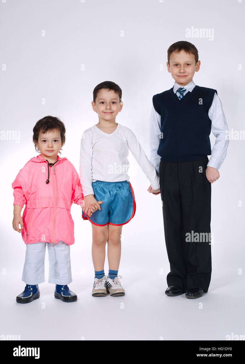 three boys on white background Stock Photo - Alamy