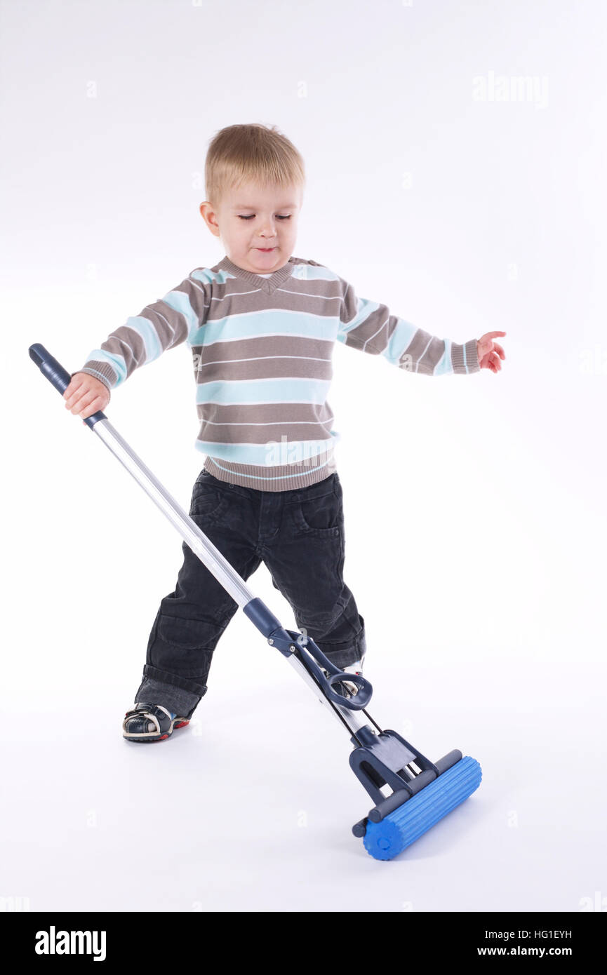 little boy with mop on white Stock Photo - Alamy