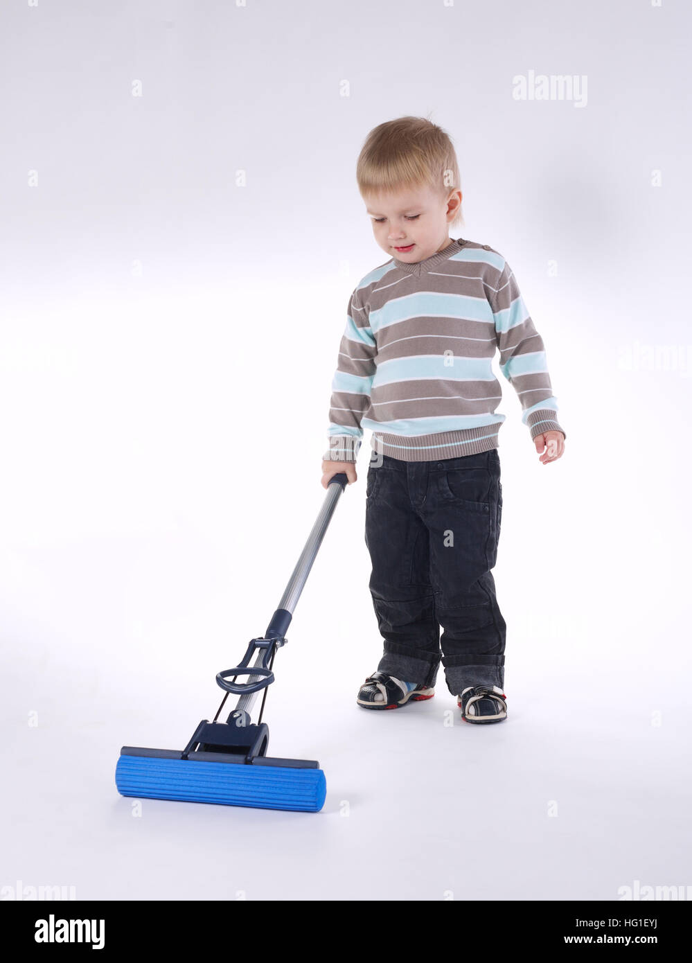 little boy with mop on white Stock Photo - Alamy