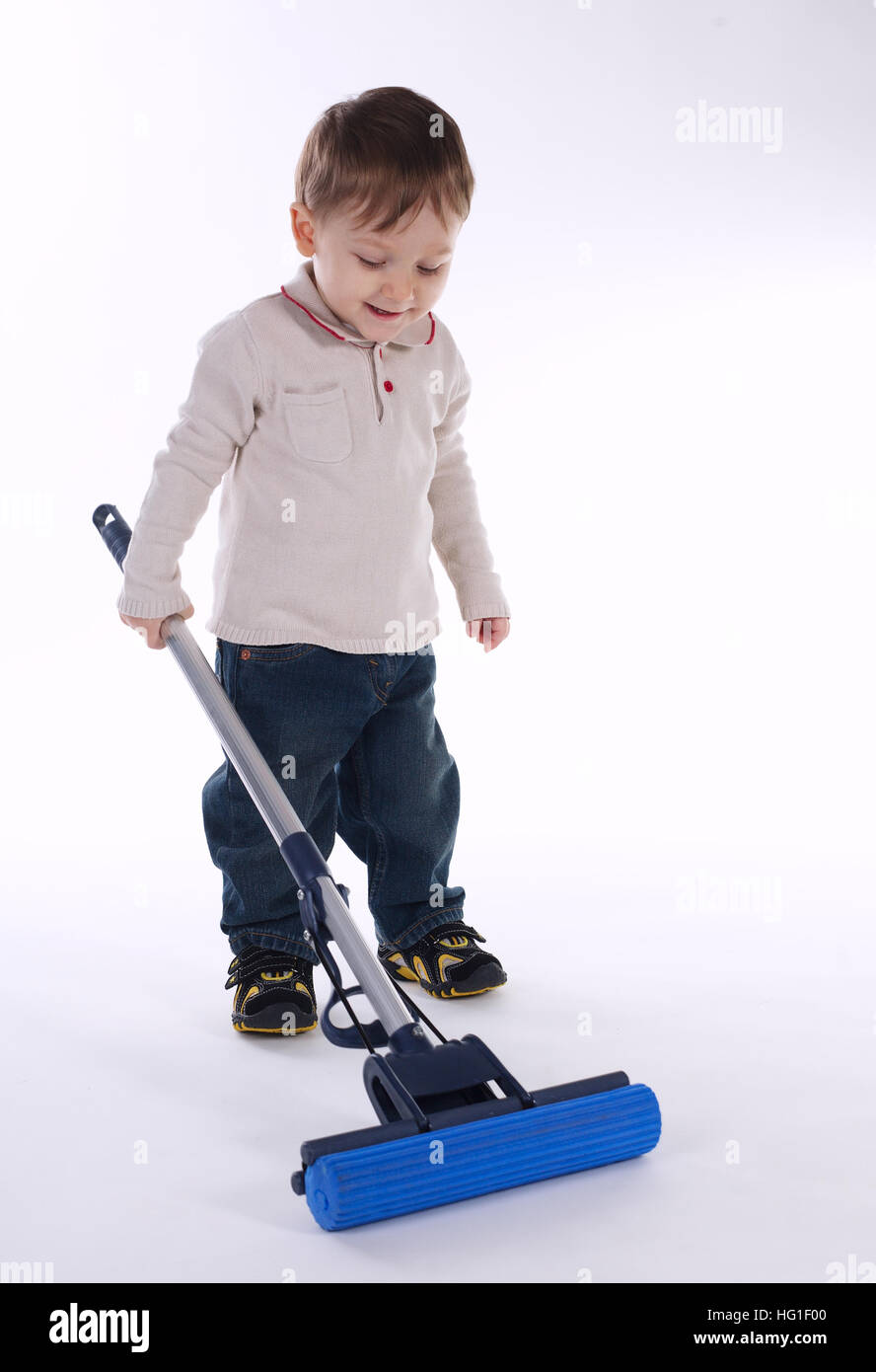 little boy with mop on white Stock Photo - Alamy