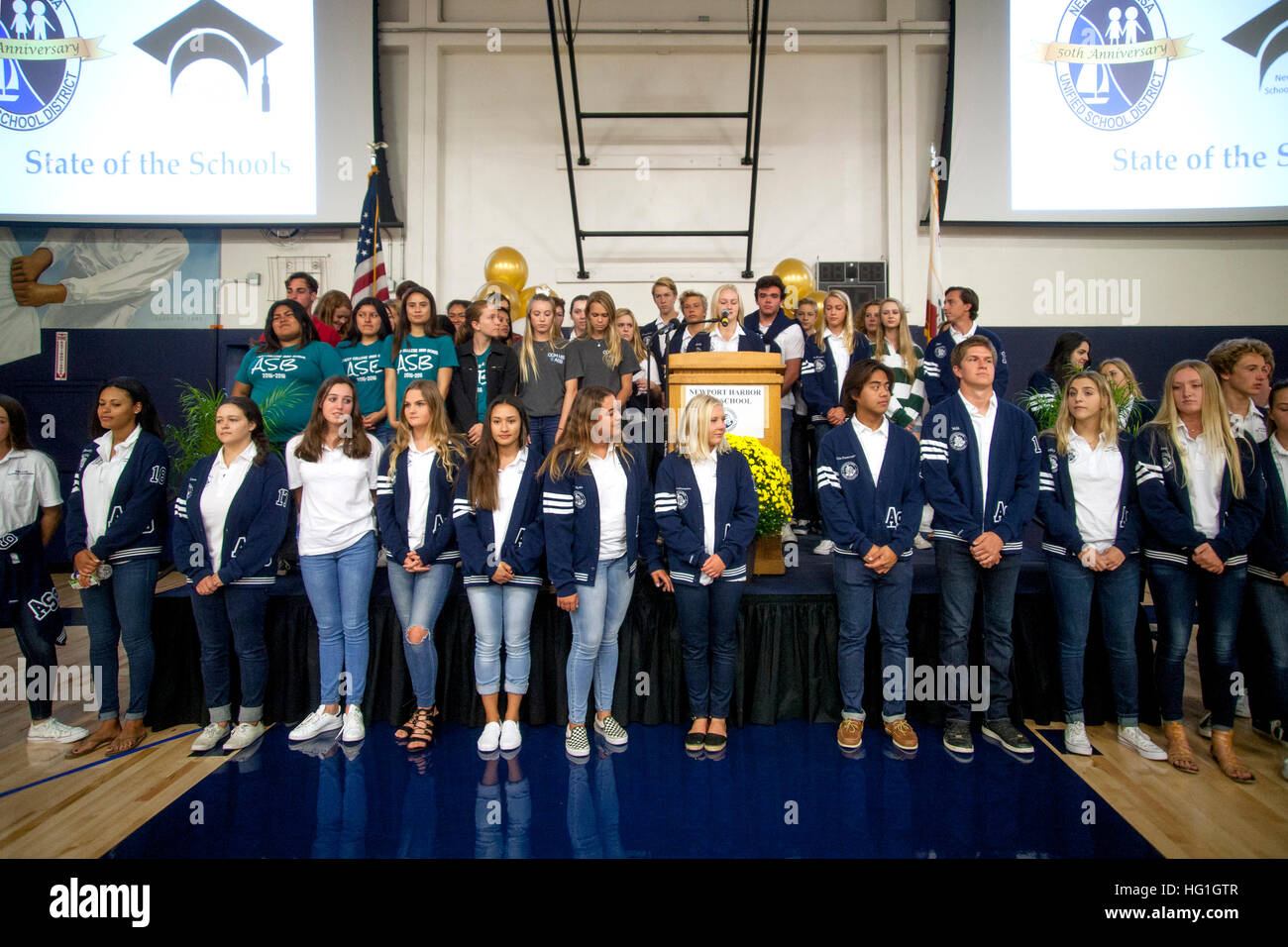 Standing at lectern, the Associated Student Body President presides at ...