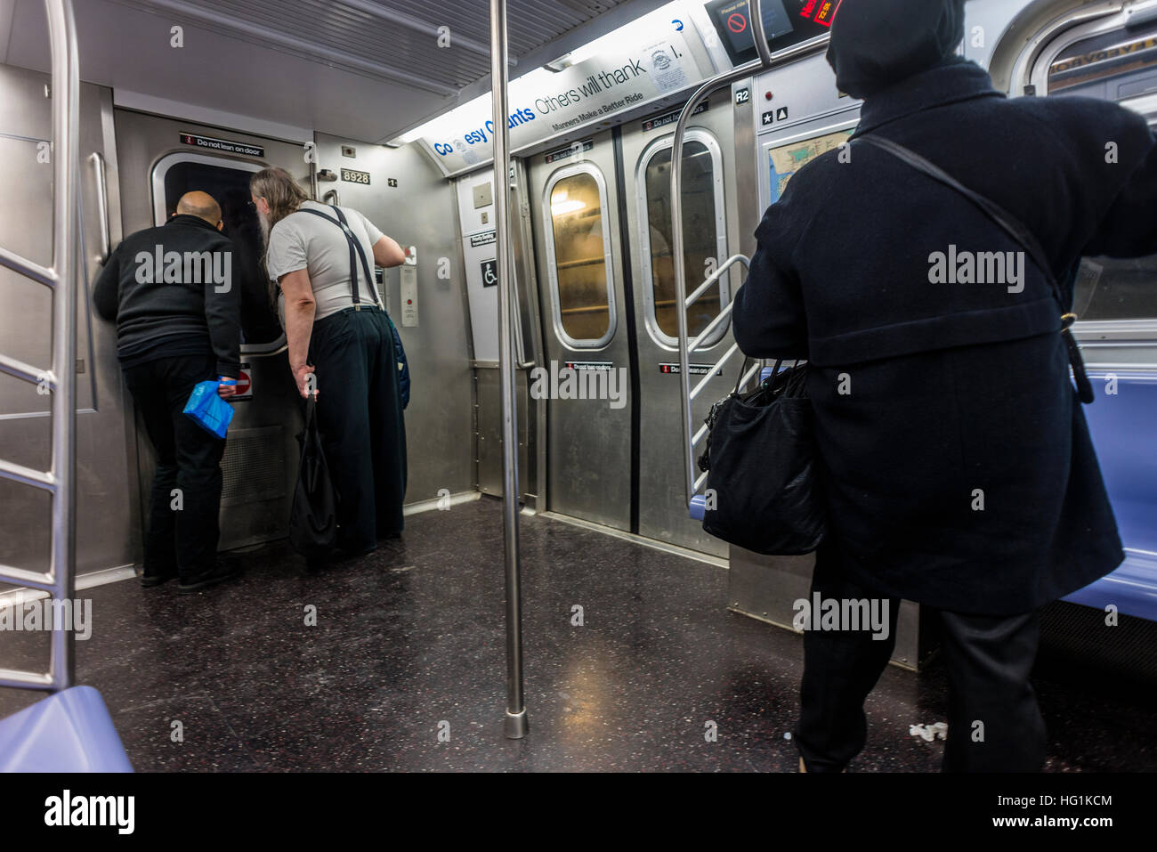 New York, USA 1 January 2017 - Subway enthusiasts peer out the front ...