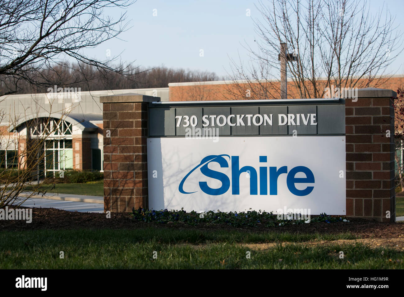 A logo sign outside of a facility occupied by Shire Plc in Exton ...