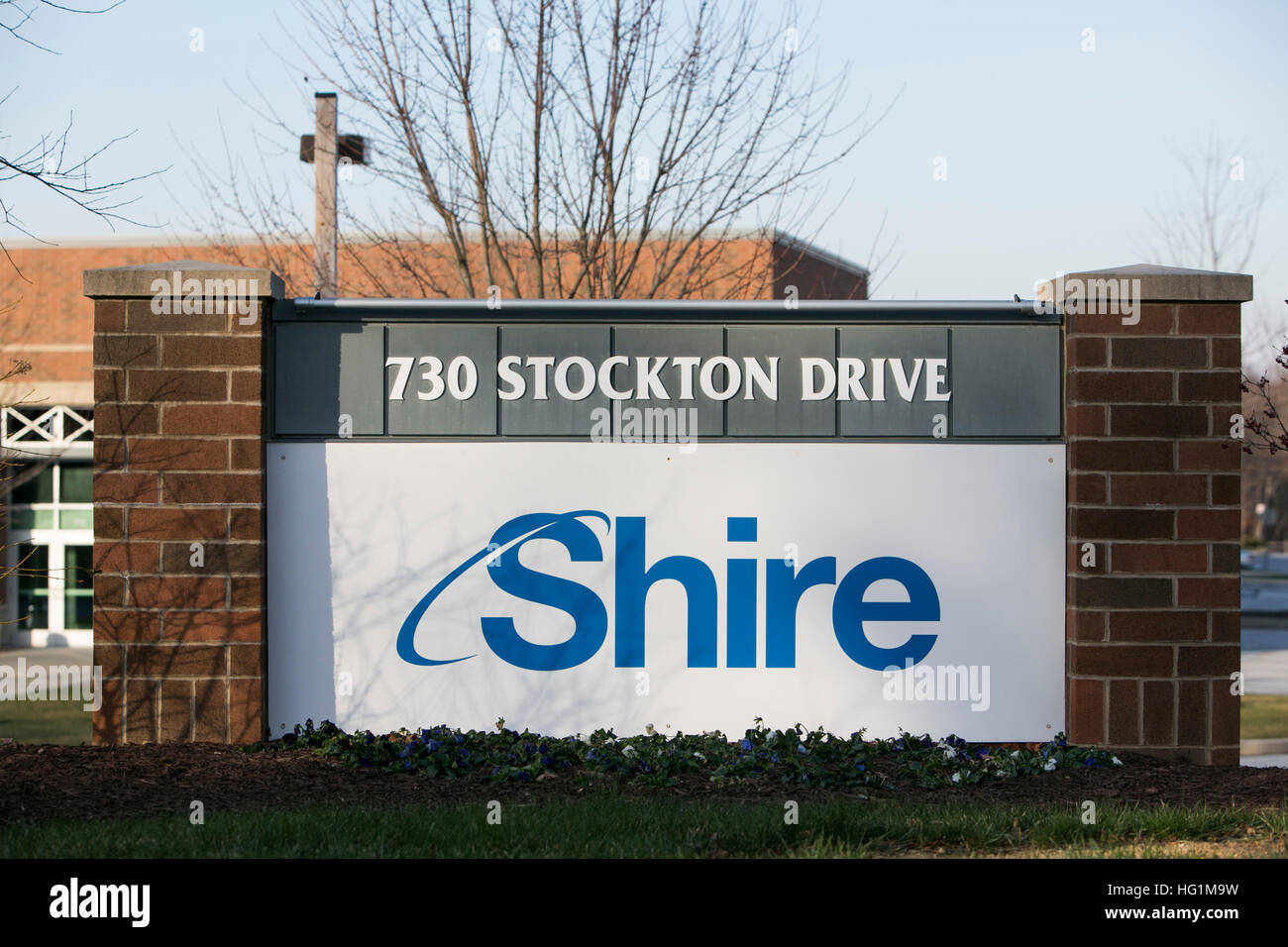 A logo sign outside of a facility occupied by Shire Plc in Exton ...