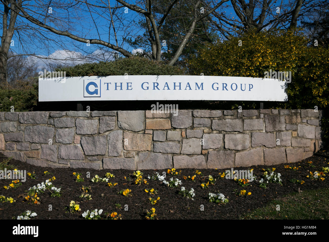 A logo sign outside of a facility occupied by The Graham Group in ...