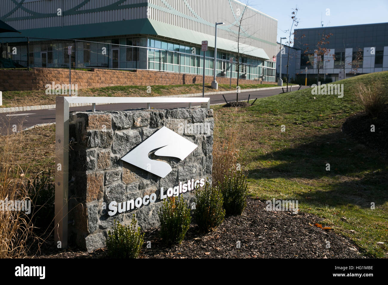 A logo sign outside of a facility occupied by Sunoco Logistics Partners ...