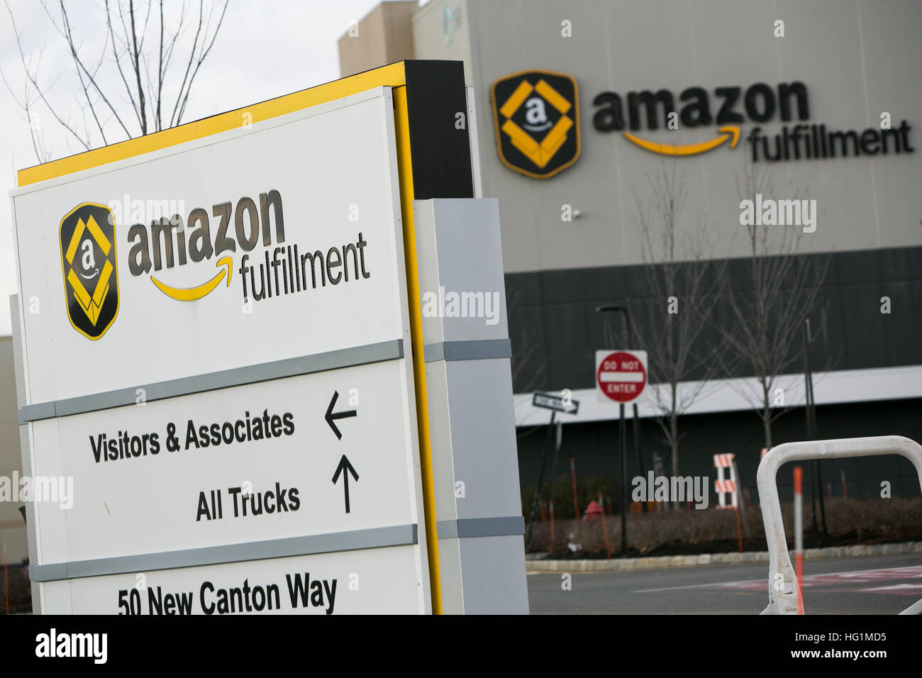 A logo sign outside of an Amazon Fulfillment center in Robbinsville ...