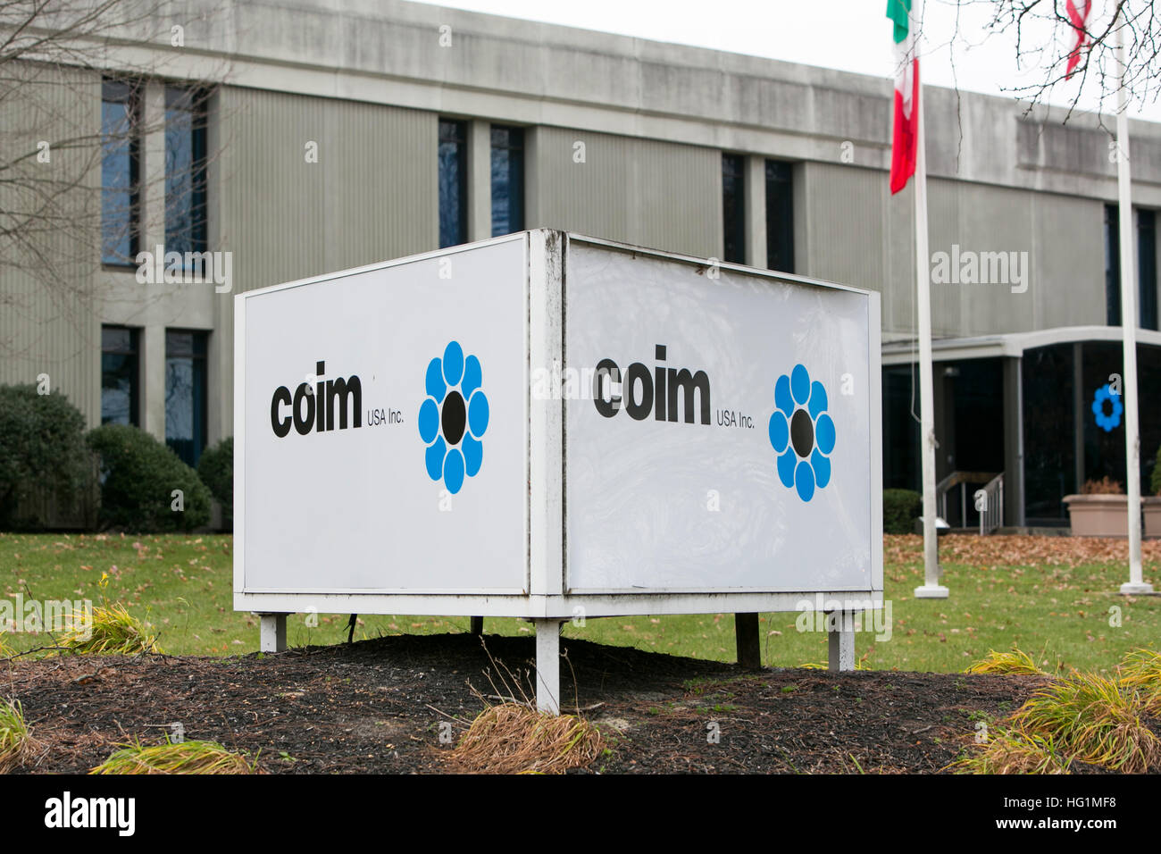 A logo sign outside of a facility occupied by Coim USA, Inc., in West ...