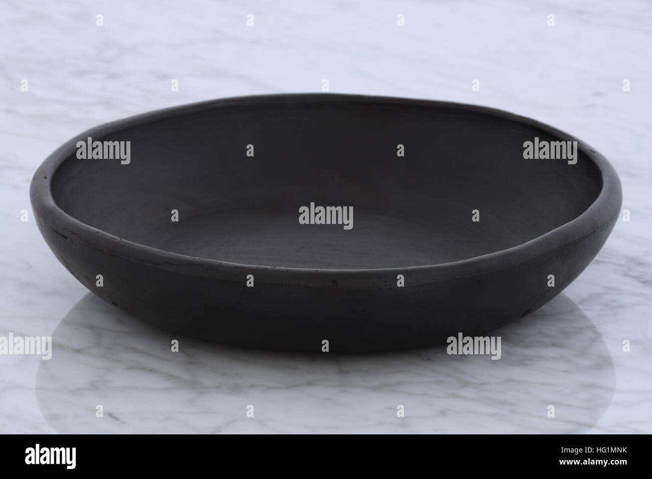 colombian clay plate on vintage carrara marble Stock Photo - Alamy