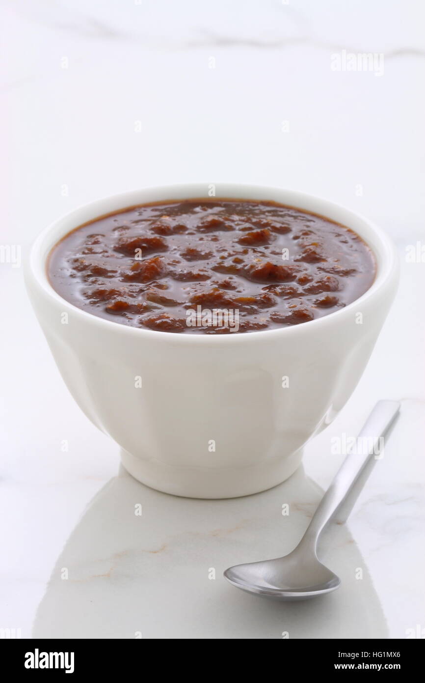 Artisan mexican chipotle sauce on vintage carrara marble table, with a ...