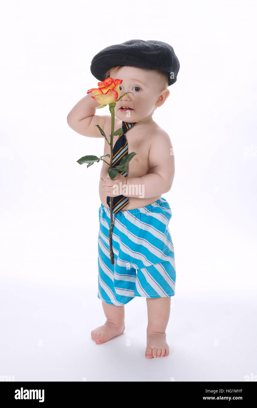 little funny boy with rose on white Stock Photo - Alamy