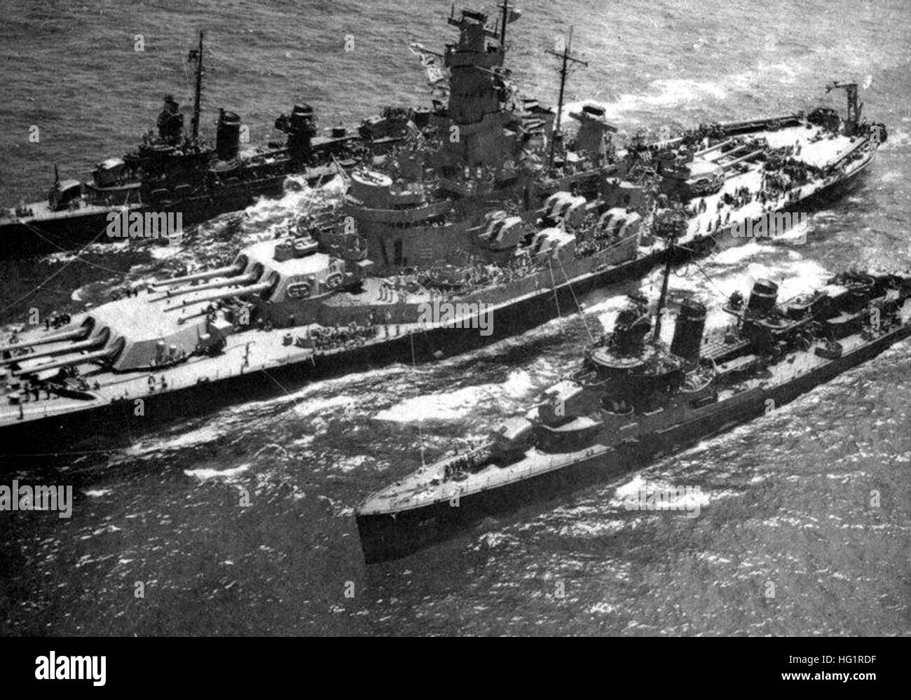 USS Massachusetts (BB-59) refuels Fletcher class destroyers 1945 Stock ...