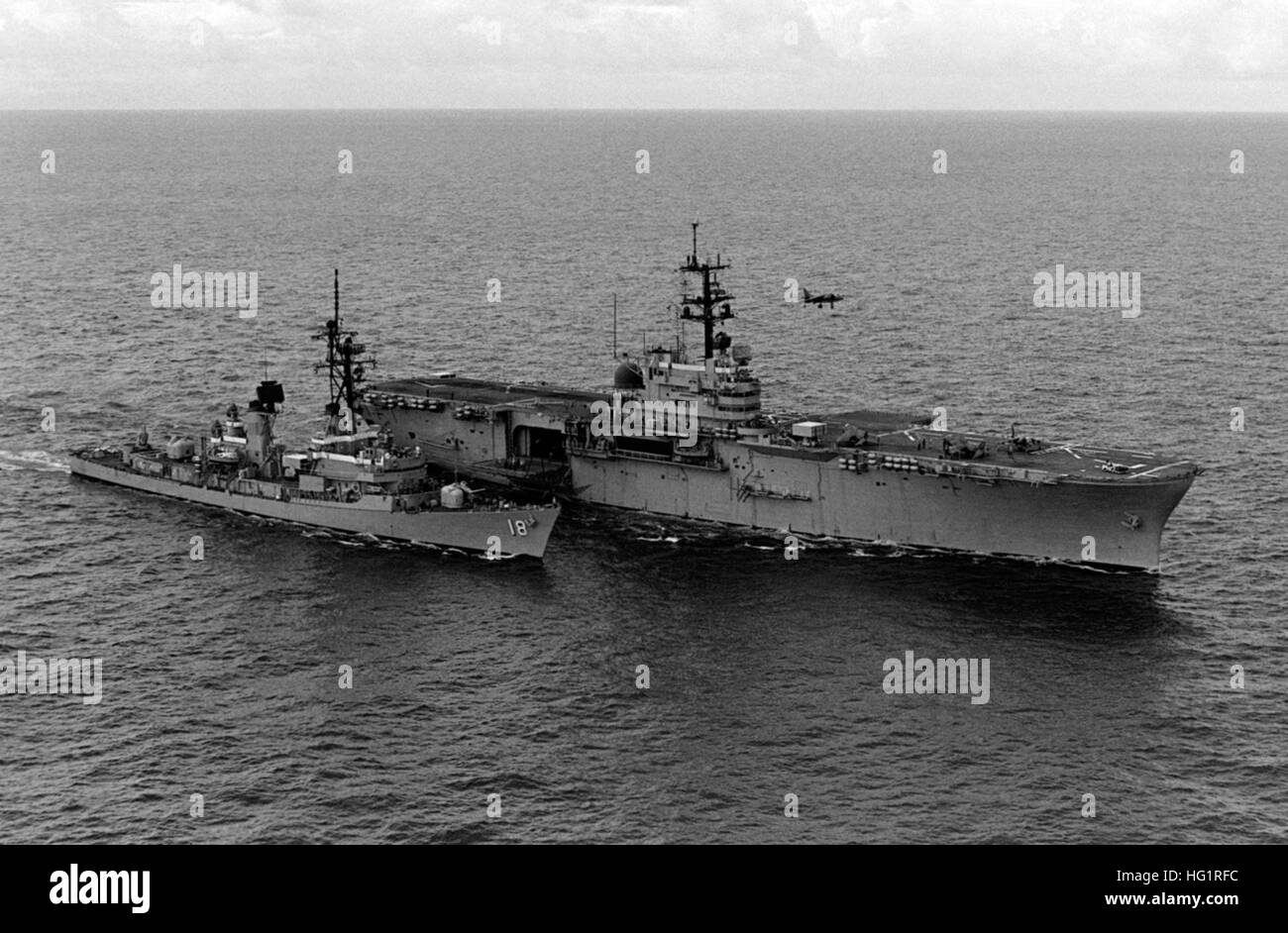 USS Guadalcanal (LPH-7) refueling USS Semmes (DDG-18) 1983 Stock Photo ...