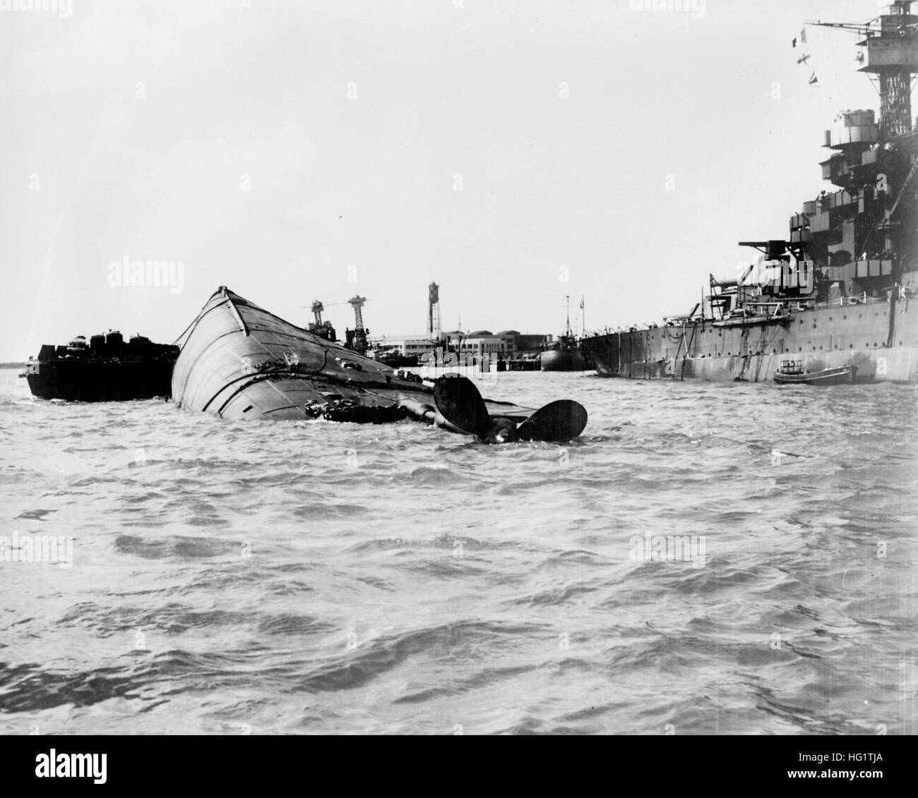 USS Oklahoma (BB-37) capsized at Pearl Harbor (view from aft Stock ...