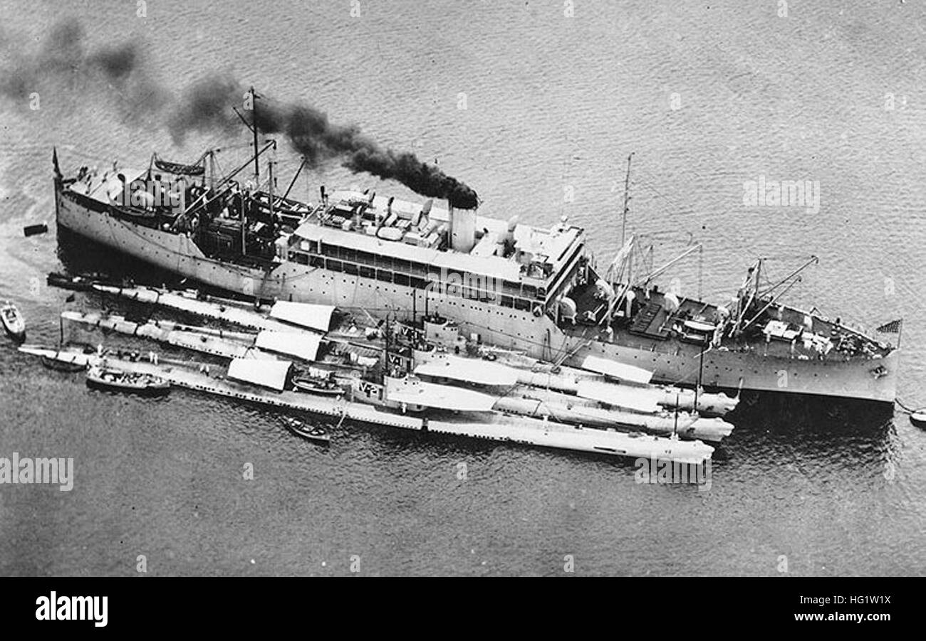 The image shows the U.S. Navy repair ship USS Argonne (AS-10) alongside ...