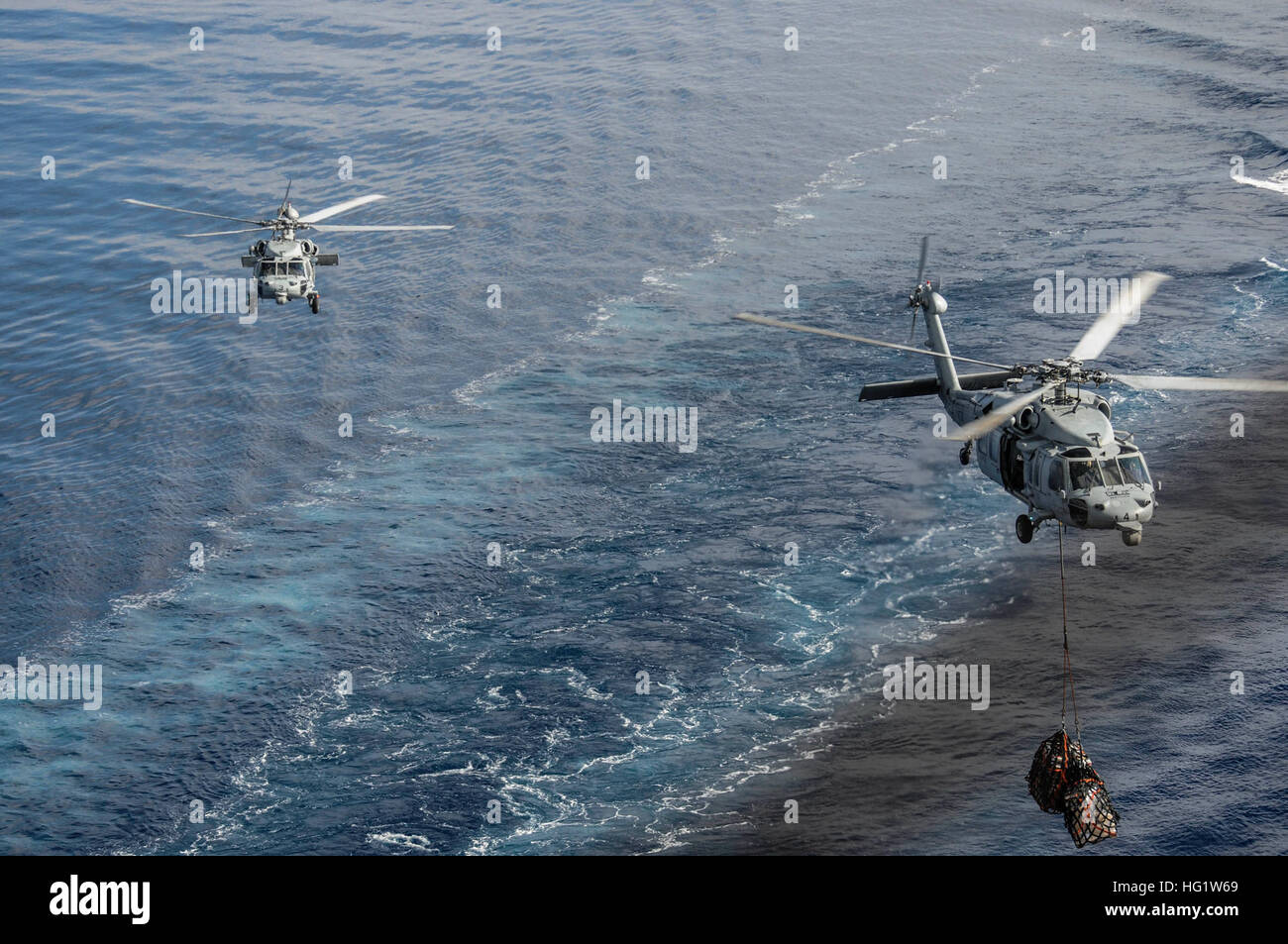 Two MH-60S Seahawk helicopters, assigned to the "Indians" of Helicopter Sea Combat Squadron (HSC ...