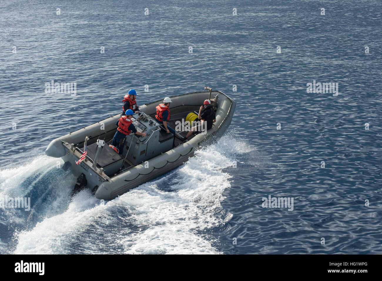 Sailors conduct small boat operations during a man overboard drill ...
