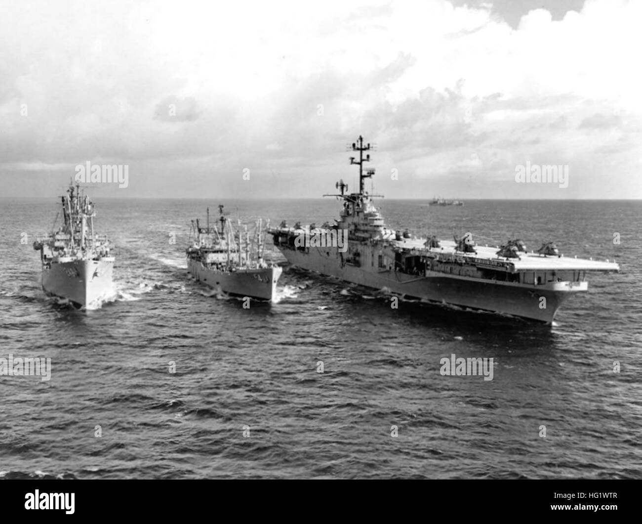 USS Mount Baker (AE-4) replenishing Valley Forge (LPH-8) and Paul ...