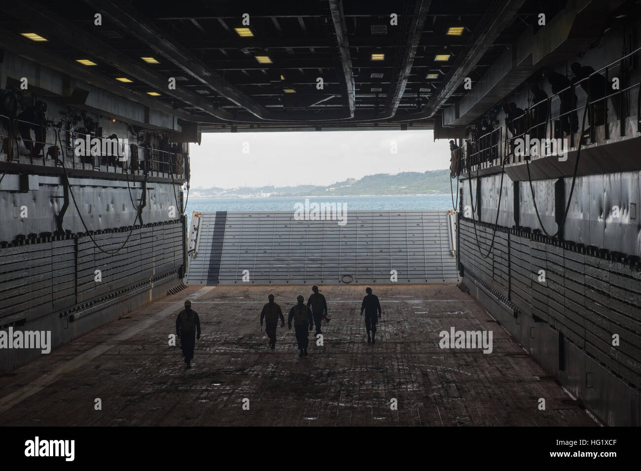 OKINAWA, Japan (Feb. 5, 2014) – Sailors prepare the well deck for the ...