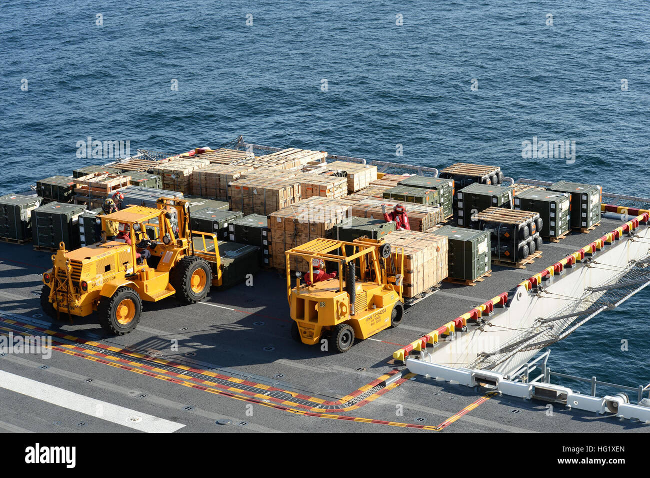Aviation Ordnancemen transport ammunition stacks during an ammunition ...