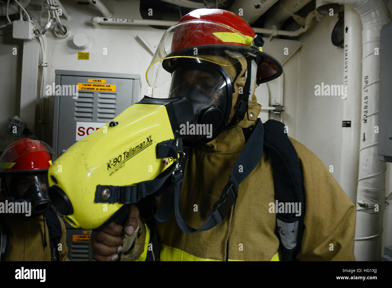 U.S. Navy Damage Controlman 2nd Class Kareem Smith uses a naval ...
