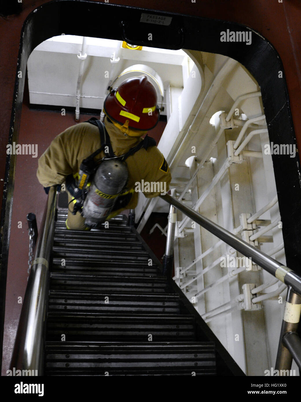 U.S. Navy Damage Controlman 3rd Class Daniel Perry participates in a ...