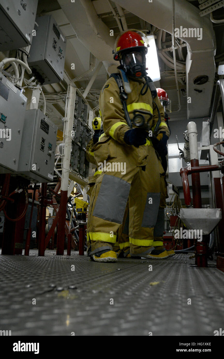 U.S. Navy Damage Controlman 3rd Class Daniel Perry participates in a ...