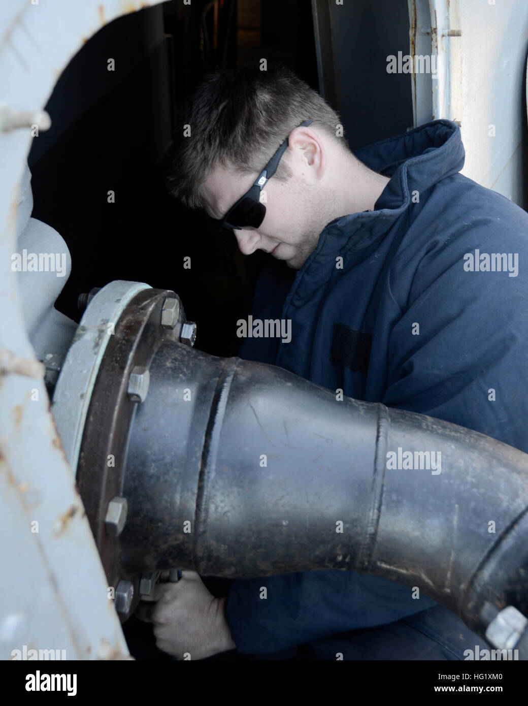U.S. Navy Seaman Hayden Bombard prepares a ship-to-shore fueling ...