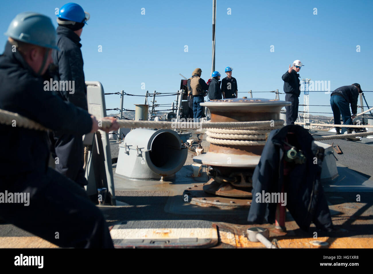 Chief Boatswain’s Mate signals Sailors to pull mooring lines as guided ...