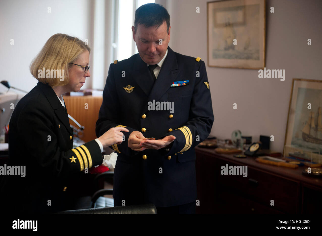 Cmdr. Camille Flaherty, left, commanding officer of the guided-missile ...