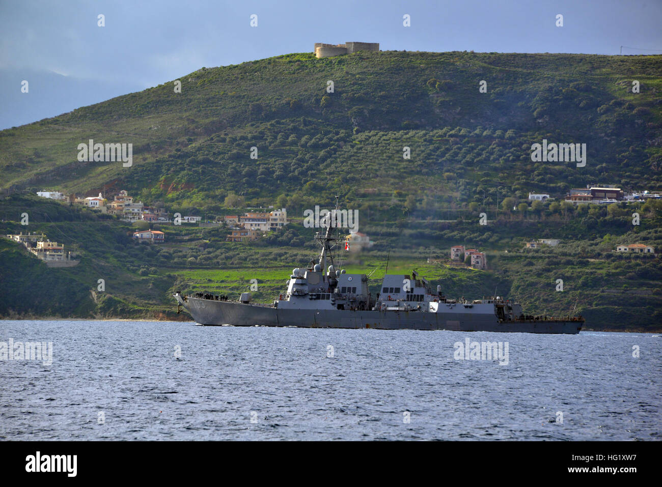 The guided‑missile destroyer USS Truxtun (DDG 103) departs the pier at ...