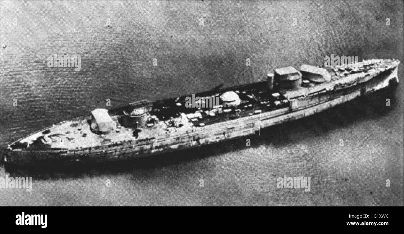 The hulk of the battleship USS Oklahoma (BB‑37) is shown at Pearl ...