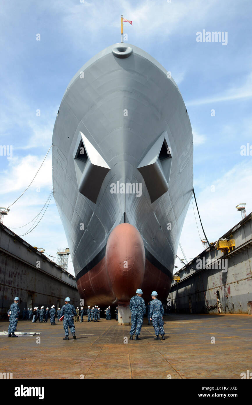 Sailors aboard USS Green Bay (LPD 20) sign the ship's hull at NASSCO ...