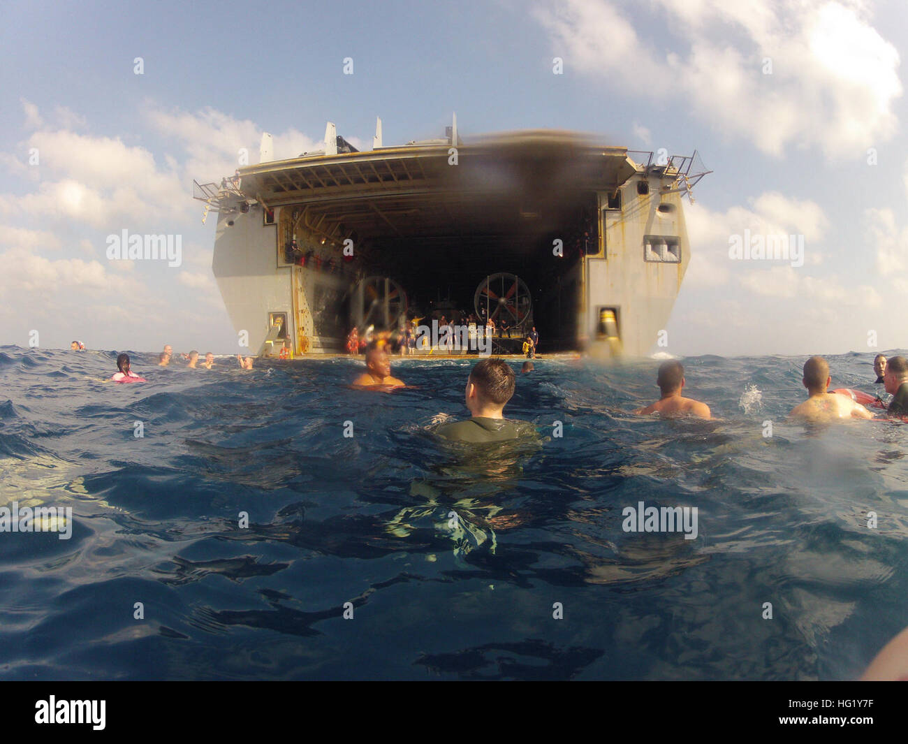 Sailors and Marines participate in a swim call off the stern gate of ...