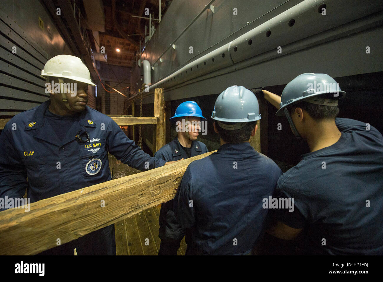 Sailors construct wood shoring to hold Landing Craft Unit (LCU) 1666 in ...