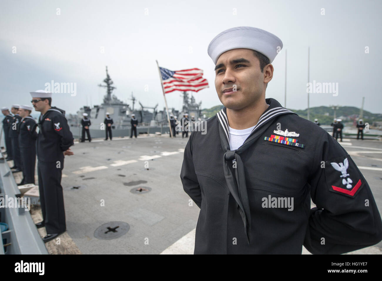 Machinist's Mate 3rd Class Daniel Rios stands at parade rest as Sailors ...