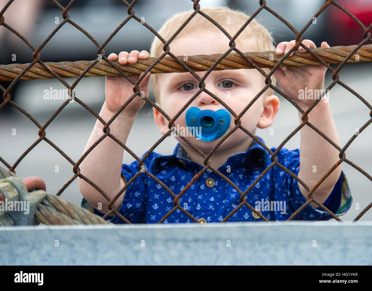 Jeremy Marks watches his father, Chief Engineman Bobby Marks, depart ...